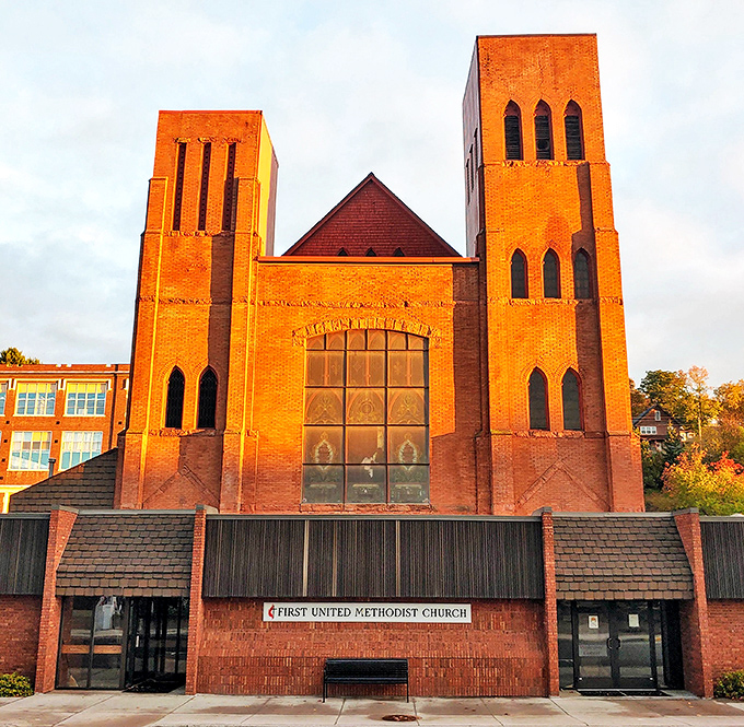 The First United Methodist Church's twin brick towers stand as architectural sentinels watching over downtown Hancock.