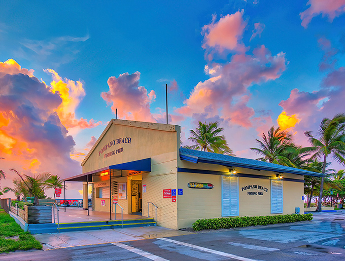 The historic fishing pier stretches toward the horizon, a wooden runway where anglers and dreamers cast their hopes into the deep blue.