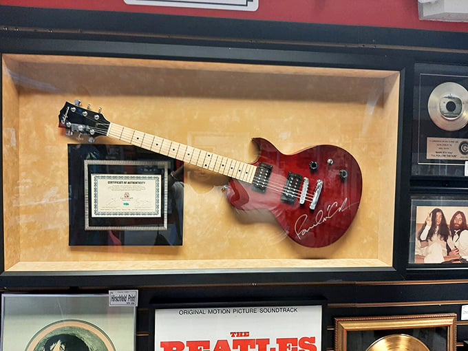 A signed guitar sits enshrined like the holy grail of rock memorabilia &ndash; almost too precious to look at, definitely too valuable to touch.