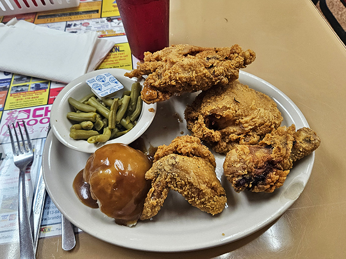 Golden-brown perfection that shatters with each bite, revealing juicy meat beneath. Those green beans aren't just an afterthought&mdash;they're the perfect sidekick.