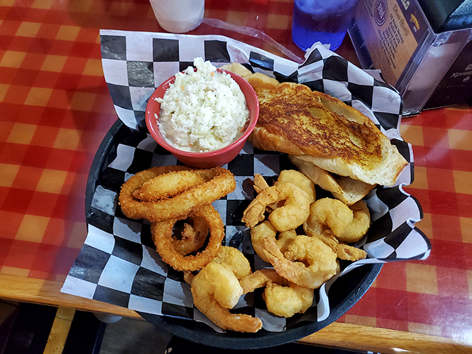 Golden-fried treasures from the sea alongside crispy onion rings. When you need a break from smoke, this seafood platter delivers coastal Florida delights.