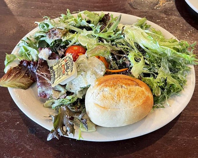 This isn't just any salad – it's a vibrant German garden on a plate, complete with a fresh roll that's begging to be buttered.