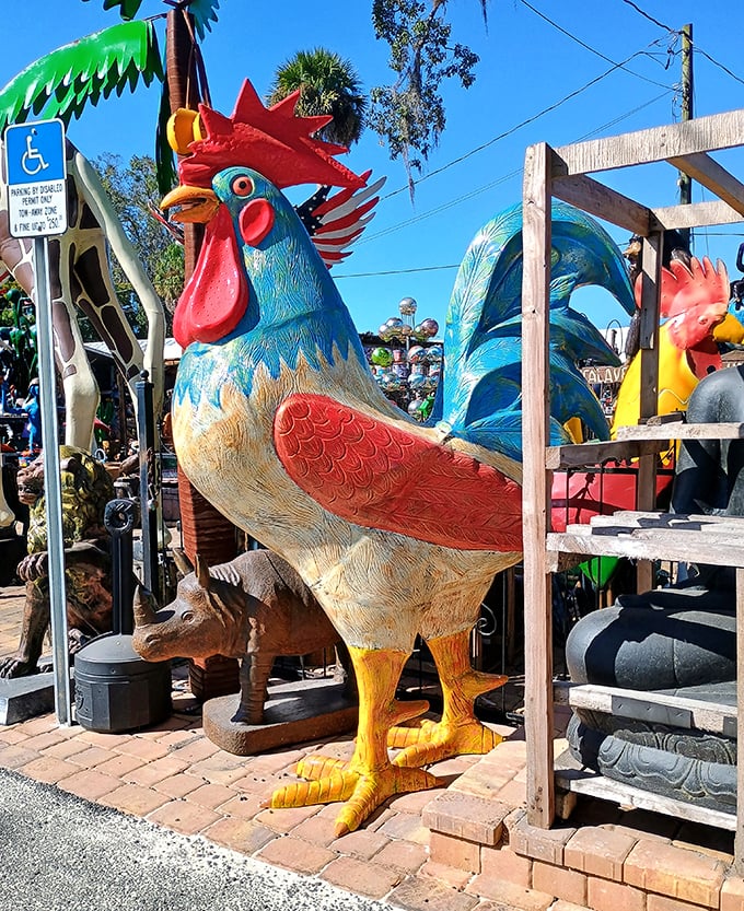 A colorful rooster stands proud, its vibrant plumage bringing a splash of whimsy to the garden statue collection.