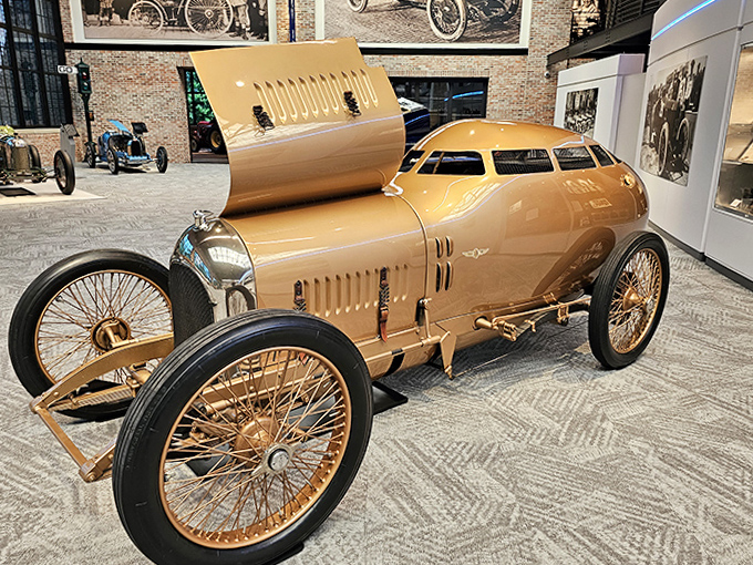 This golden vintage racer looks like it was dipped in liquid sunshine, a streamlined beauty from an era when aerodynamics was still being figured out.