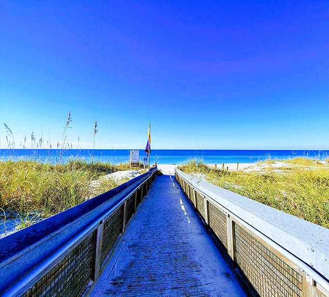 Nature's red carpet treatment: This boardwalk invites you to strut your stuff between sea oats toward the Gulf's emerald stage.