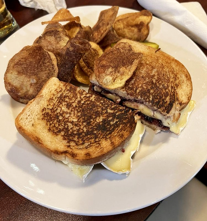 The humble grilled cheese achieves sandwich stardom here &ndash; golden-brown perfection with melty cheese that stretches dramatically with each bite.