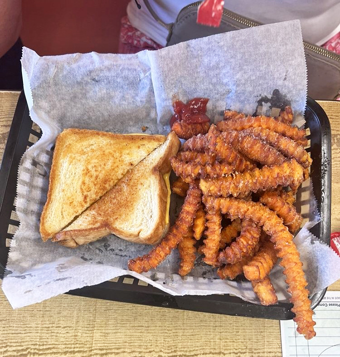 A grilled cheese that transcends its humble ingredients, proving that even the simplest dishes shine with proper attention.