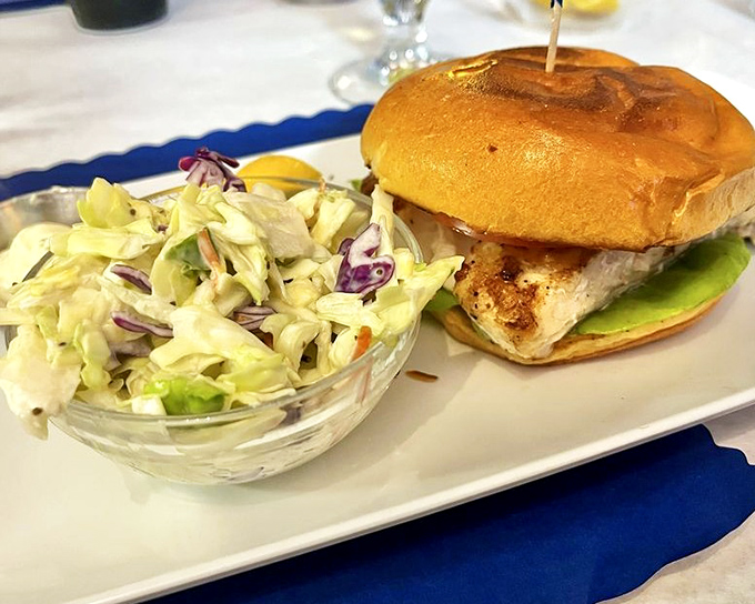 Simple perfection on a brioche bun – where the star is the fish itself, complemented by crisp, tangy slaw.
