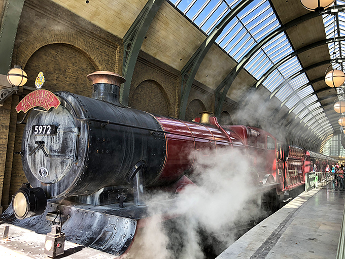 The Hogwarts Express awaits, billowing steam and promises of magical journeys between parks &ndash; all aboard for wizarding adventures!
