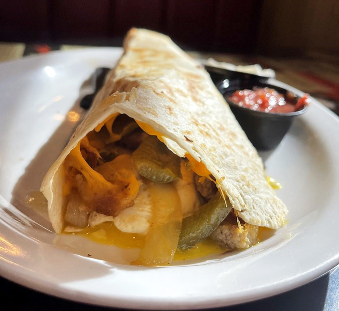Peek inside the burrito's golden exterior to discover a treasure trove of eggs, cheese, and perfectly seasoned fillings waiting to be devoured.