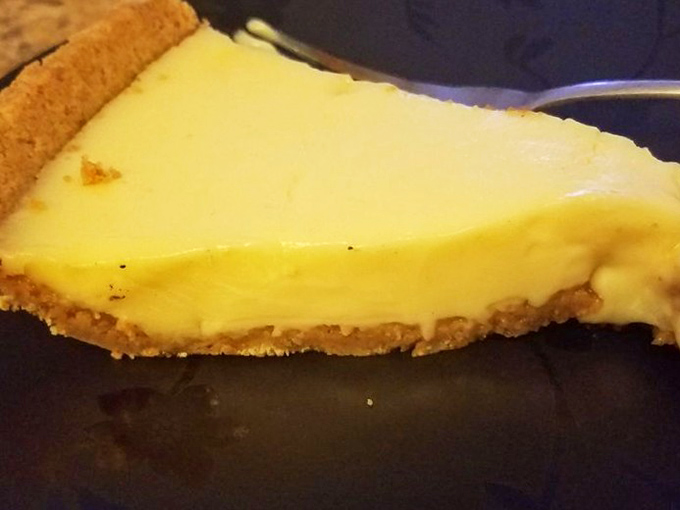 A slice of key lime heaven with that signature pale yellow filling and buttery graham cracker crust that haunts your dreams.