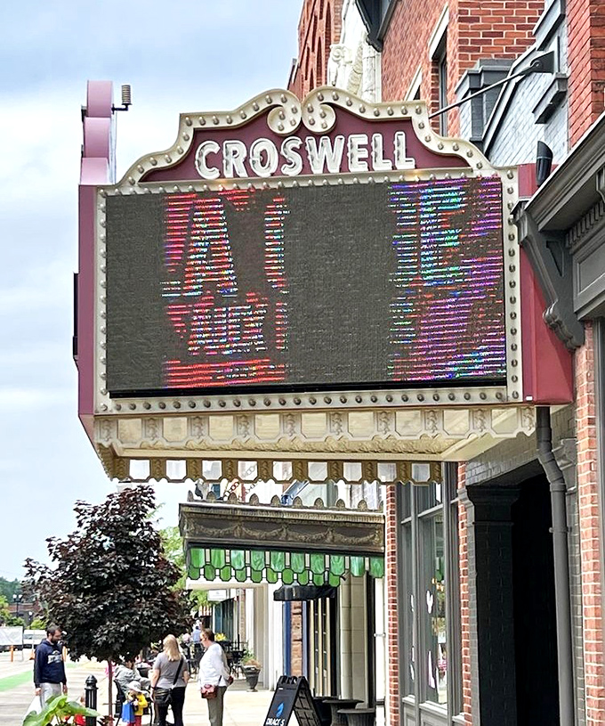 The Croswell's illuminated marquee announces upcoming shows, a glowing invitation to step back in time while enjoying contemporary entertainment.