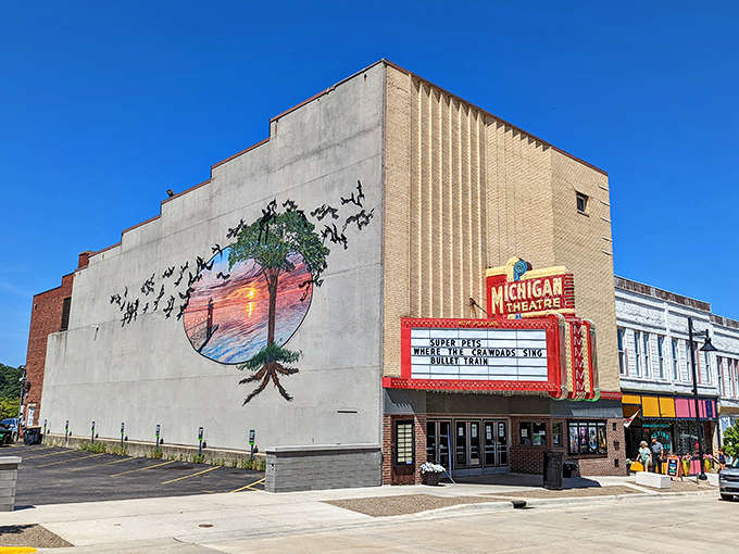 The Michigan Theatre's classic facade, where the marquee promises entertainment and the building delivers small-town charm in spades.