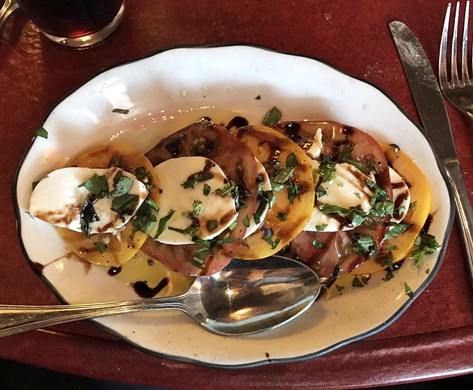 Mozzarella Caprese: Summer on a plate! These heirloom tomatoes and buffalo mozzarella are having such a good time with that basil and olive oil.