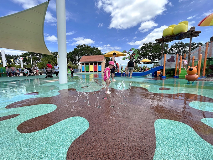 The Muddy Puddles Splash Pad brings Peppa's favorite activity to life – where squeals of delight mix with splashing water under Florida's sunny skies.