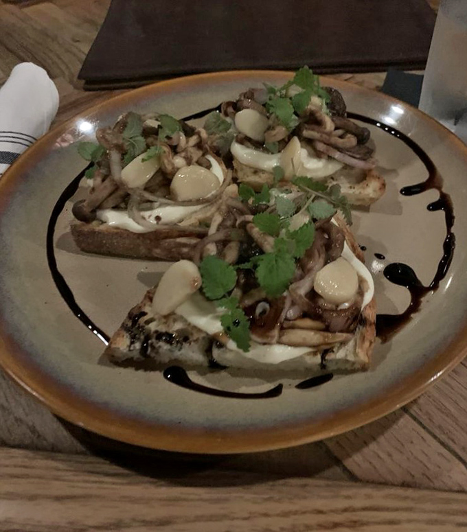 Forest on toast: Earthy mushrooms mingle with bright herbs and creamy dollops on crusty bread – proof that bar food can be sophisticated.