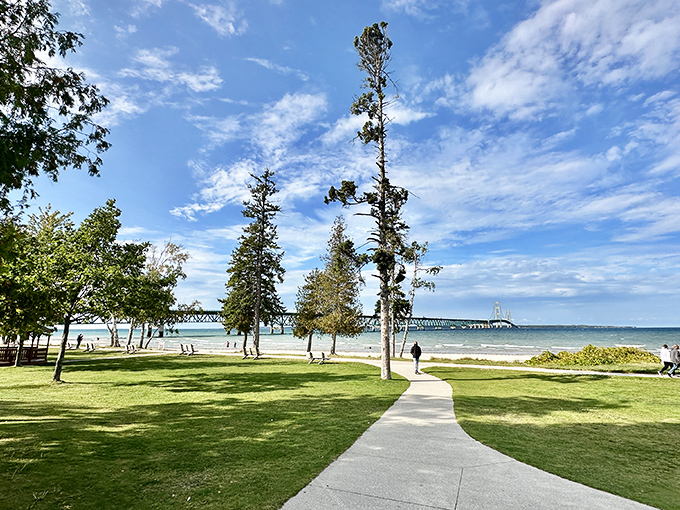 A peaceful path leads visitors through the well-maintained grounds, where maritime history meets natural beauty at every turn.