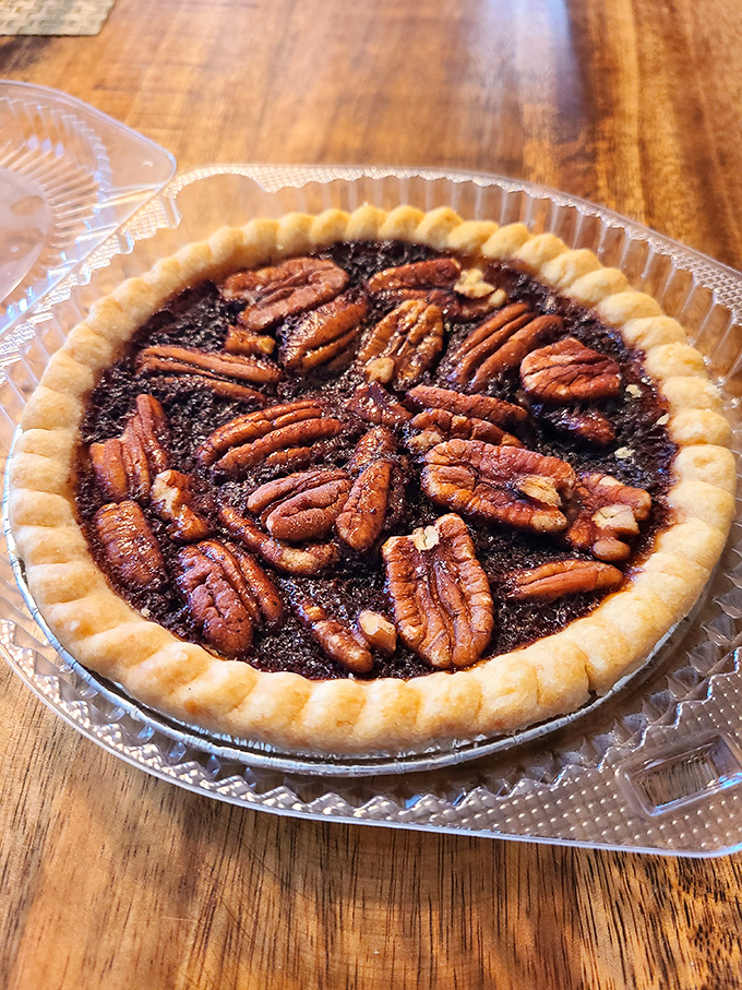 Glistening pecans arranged like a mosaic atop a rich, caramelized filling &ndash; Southern comfort in its most delicious form.
