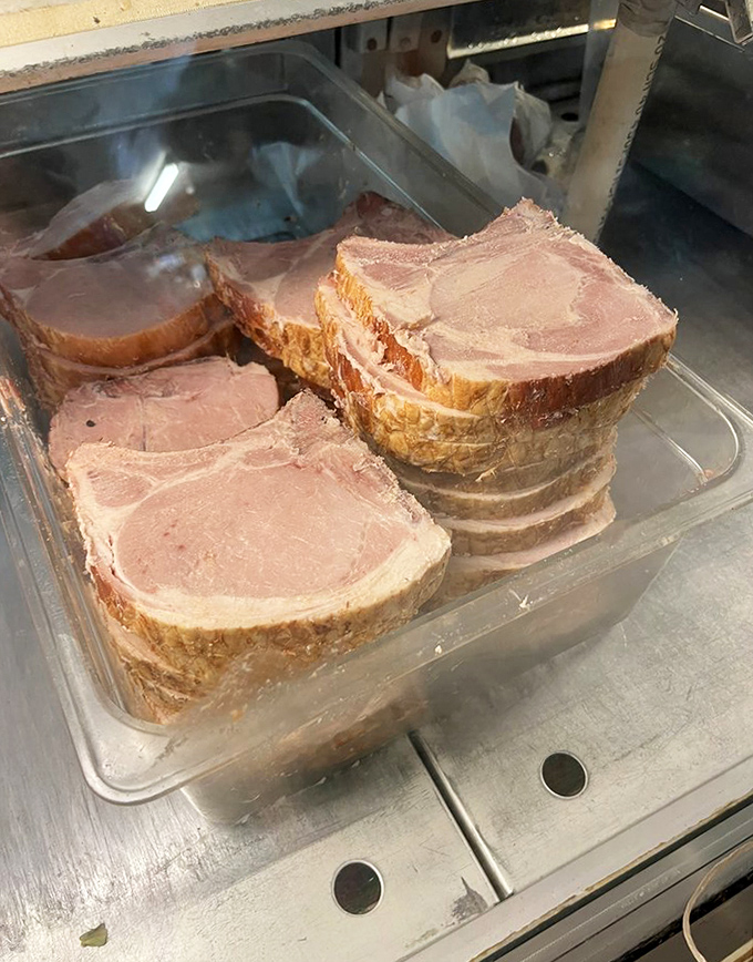 Thick-cut pork chops await their destiny in the meat case &ndash; no factory farming here, just honest cuts that would make your grandfather nod approvingly.