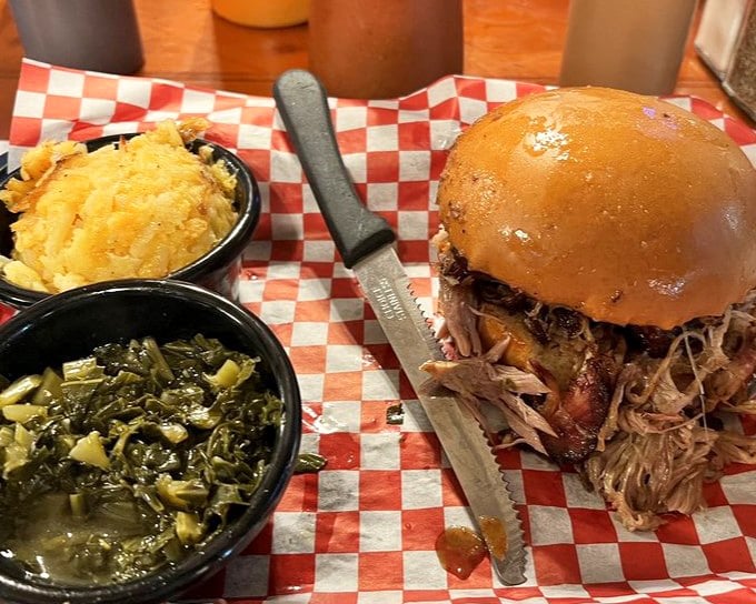 This pulled pork burger isn't just a sandwich&mdash;it's an architectural marvel of smoke-kissed meat, perfectly toasted bun, and sides that refuse to be ignored.