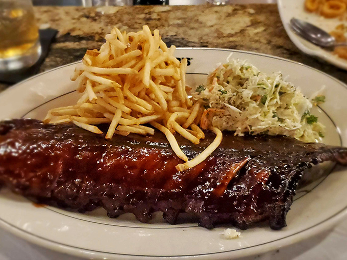 Ribs that make resistance futile &ndash; tender meat clinging to the bone just enough to maintain dignity, with fries standing at attention alongside.