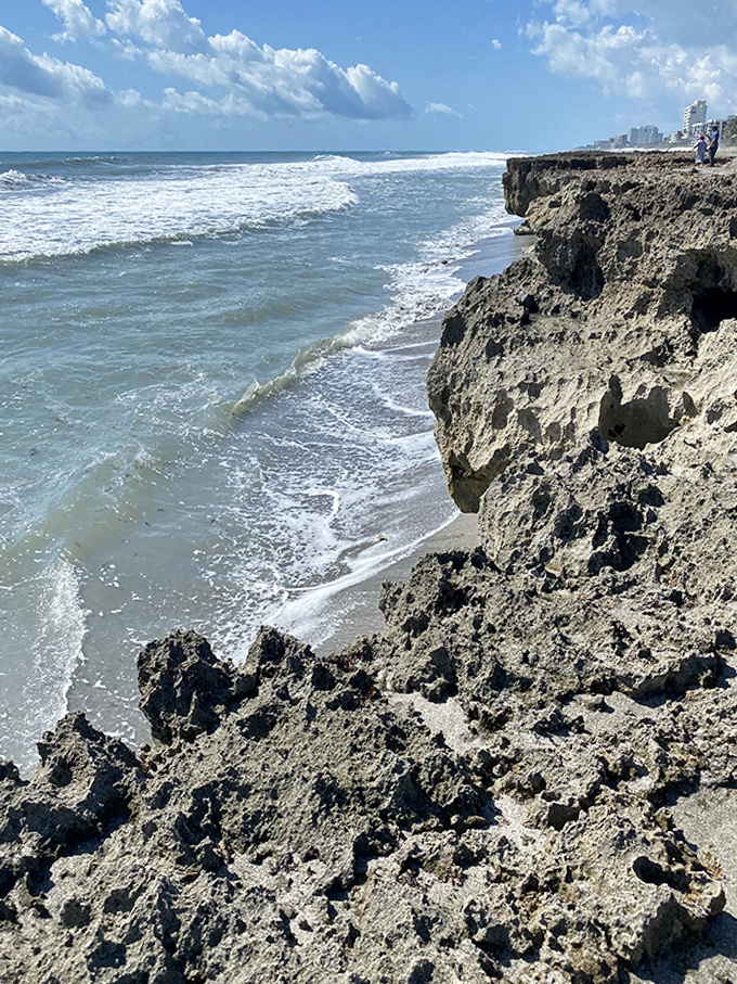 The rocky shoreline creates a jagged silhouette against the horizon, defying Florida's reputation for endless sandy beaches.