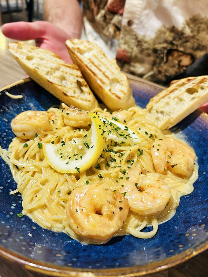 Plump Gulf shrimp swim in a buttery, garlicky sauce alongside perfectly al dente pasta, with grilled bread standing by to ensure not a drop goes to waste.