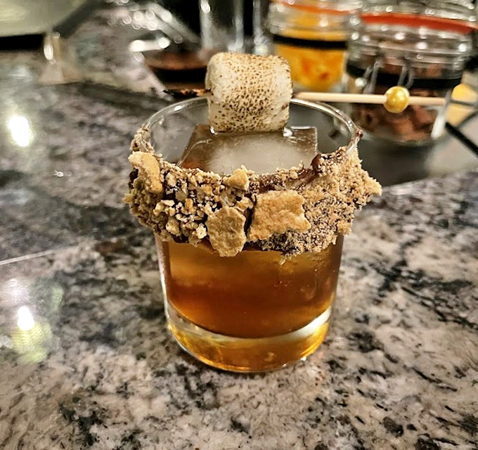S'mores in liquid form! This nostalgic cocktail transforms campfire memories into sophisticated sipping, complete with torched marshmallow and chocolate rim.