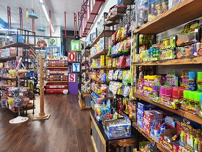 The "TOYS" sign towers like a sugary Stonehenge, guiding sugar-seekers through this carefully organized chaos of treats. 