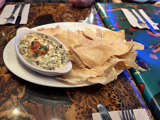 The spinach and artichoke dip arrives bubbling hot, surrounded by a mountain of tortilla chips perfect for sharing, or not.