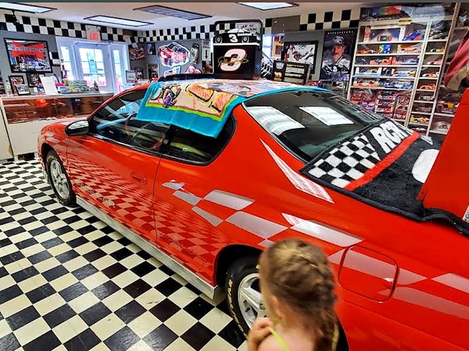 This cherry-red vintage car with racing checkered details proves that the museum's collection extends beyond traditional fire apparatus.