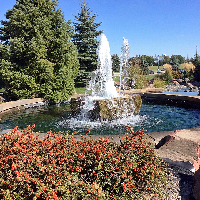 This fountain at Willkommen Park doesn't just spray water; it sprays pure Bavarian ambiance into the Michigan air.
