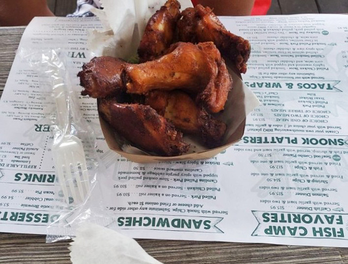 Served unpretentiously on paper, these wings don't need fancy presentation when they taste this heavenly.