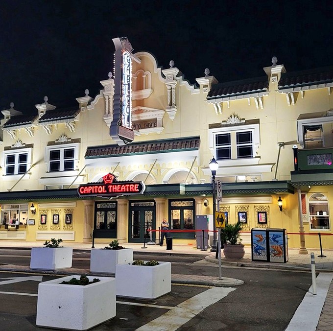 The Capitol's neon sign cuts through the night sky, a beacon for entertainment seekers and possibly the theater's resident sea captain.