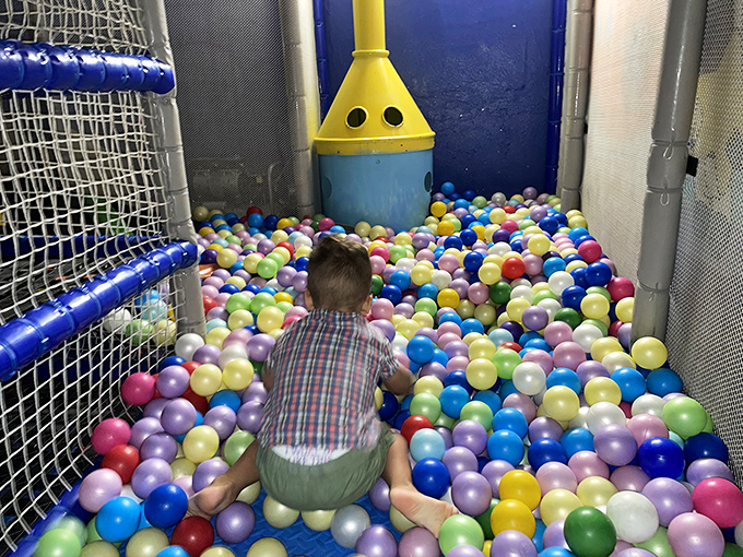 A rainbow sea of balls creates the ultimate soft landing spot, where kids can dive, swim, and bury themselves in spherical joy.