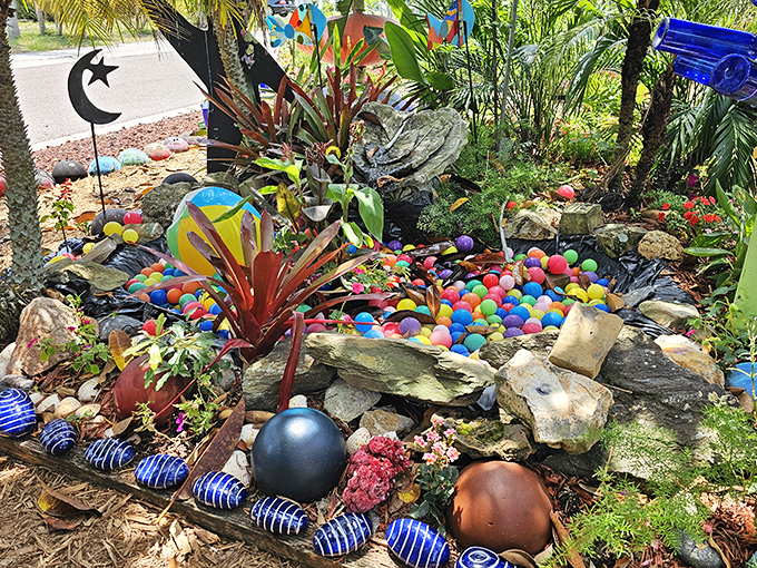This whimsical garden display bursts with colorful balls, turning an ordinary corner into a playful splash of creativity.