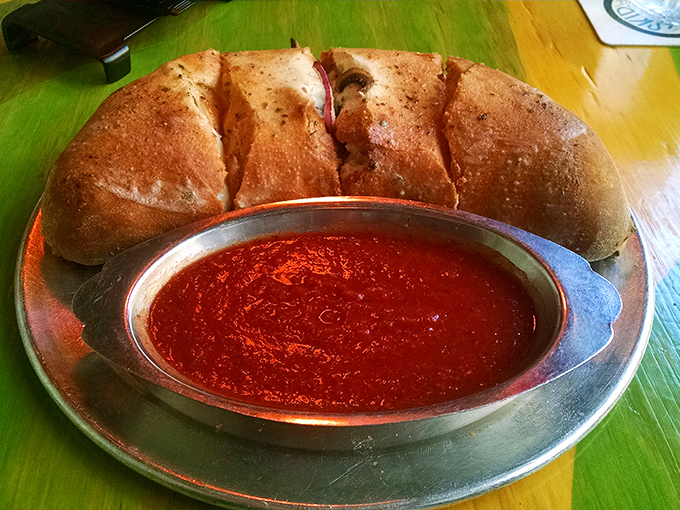 Bread and sauce, the perfect romance! This pillowy vessel of doughy goodness comes with marinara for essential dipping adventures.