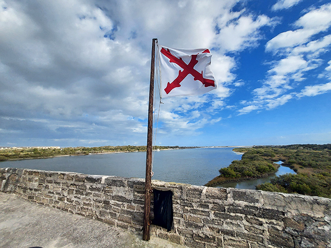 The Spanish flag flutters against a perfect Florida sky, a colorful reminder of who built this strategic outpost.