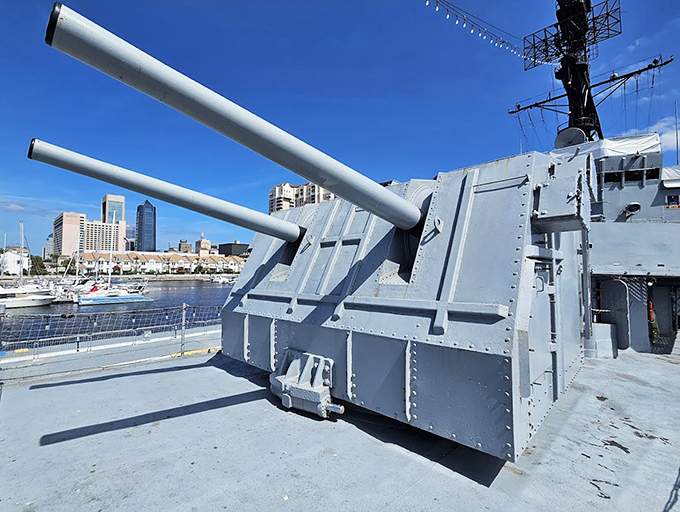 These massive naval guns once spoke with thunderous authority, now silently telling stories of American naval power to curious visitors.