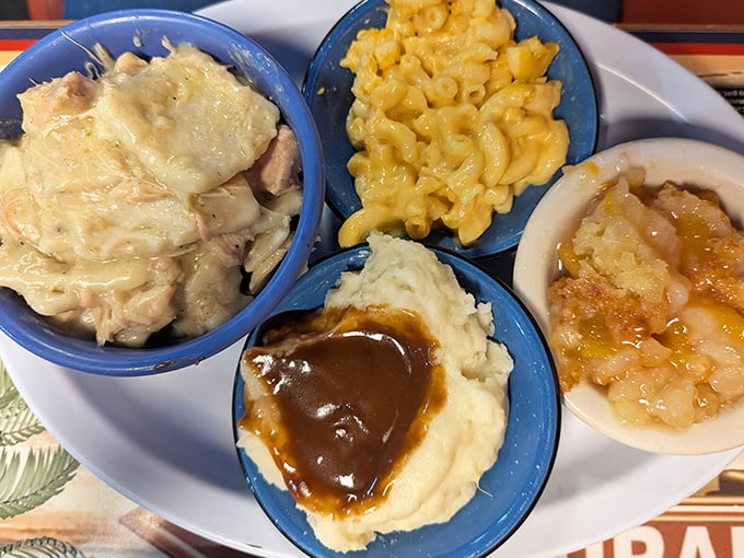 The side dish quartet that steals the show &ndash; creamy mac and cheese, mashed potatoes with gravy lakes, and homestyle vegetables done right.