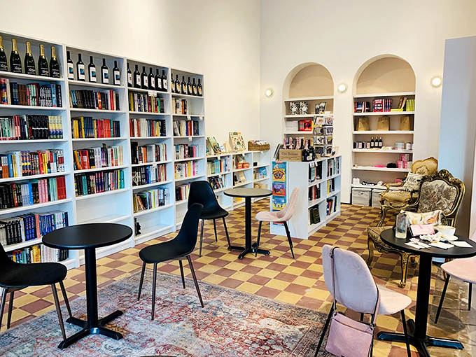 Books and bottles coexist in architectural harmony, creating corners where time slows and conversations deepen.