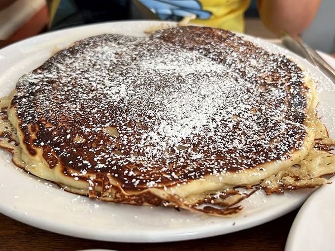 Fluffy clouds of breakfast joy, dusted with powdered sugar and waiting for that first fork dive. Resistance is futile.