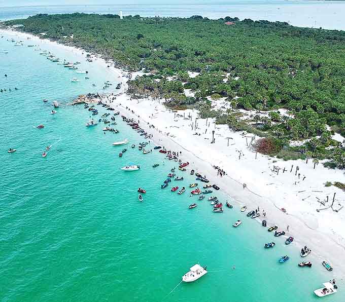 Weekend boaters create a floating community along the sandbar, turning the emerald waters into Florida's most exclusive social club.