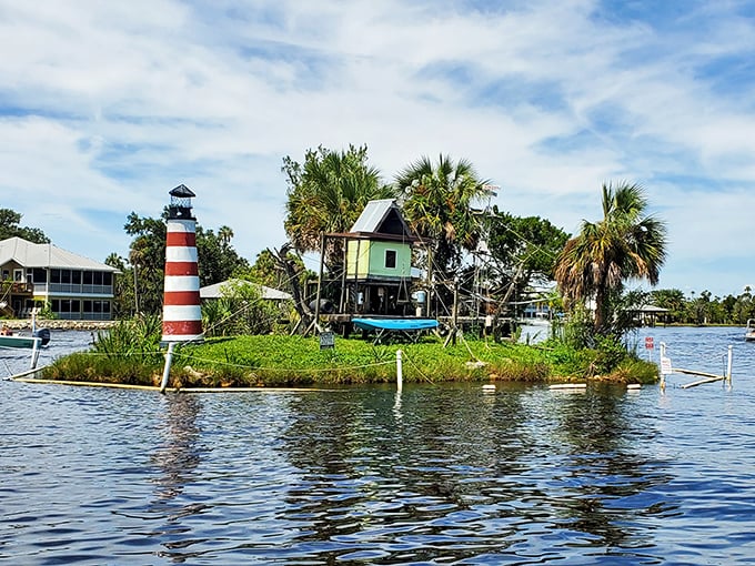 The iconic lighthouse and stilted monkey house create a postcard-perfect scene that could only exist in Florida's wonderfully weird landscape.