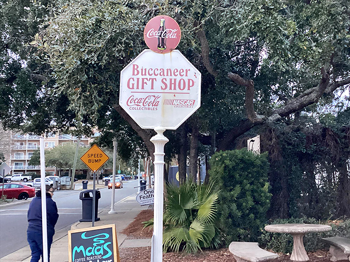The shop's vintage sign stands sentinel among palm trees, a retro beacon calling to collectors and the Coca-Cola curious alike.