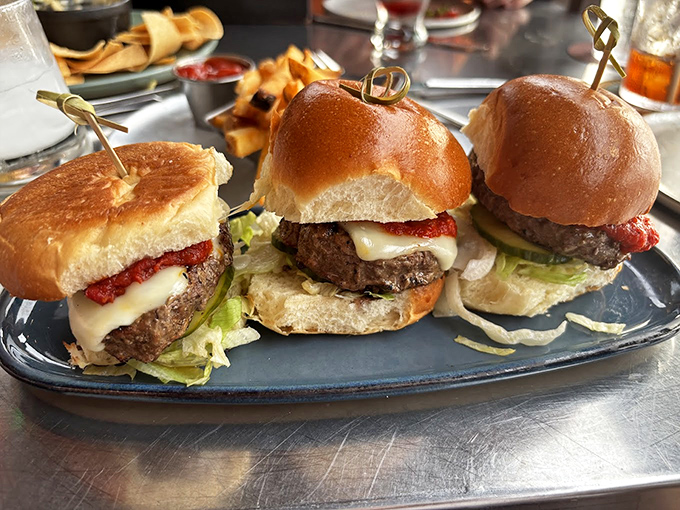 These aren't just mini burgers&mdash;they're flavor bombs with tomato-bacon jam and aged cheddar that make you question why regular-sized burgers even exist.