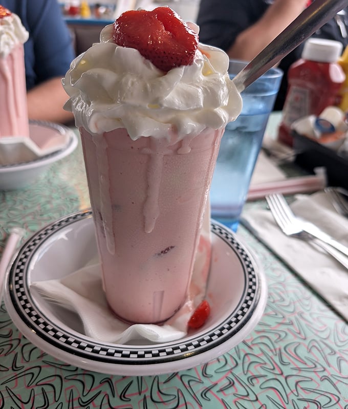 Fresh strawberries add a pop of color and flavor to this classic shake, proving that sometimes the simplest pleasures are the most satisfying.