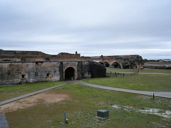 Fort Barrancas' brick archways create a stunning architectural rhythm, drawing visitors through corridors where soldiers once stood guard.