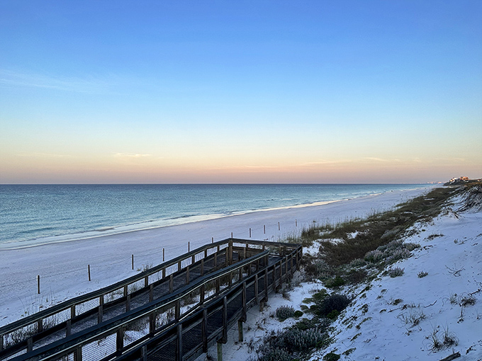 Wooden steps lead down to Grayton Beach's famous sugar-white sand, where emerald waters await just beyond.