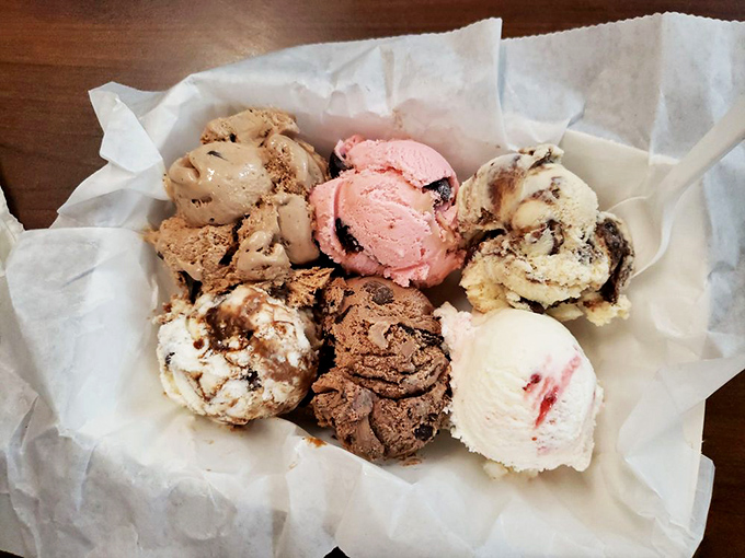 Sherman Dairy Bar's signature scoops showcase colors that pop against the classic checkered background – blue moon, strawberry, butter pecan, mint chip, and orange sherbet.